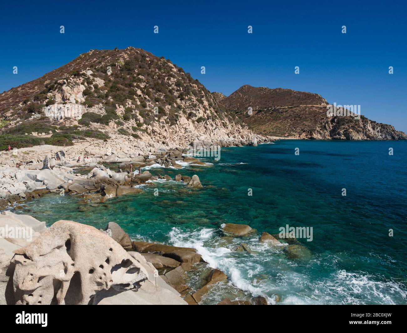 Rocky beach formed by large stones in the north of Sardinia, Italy ...
