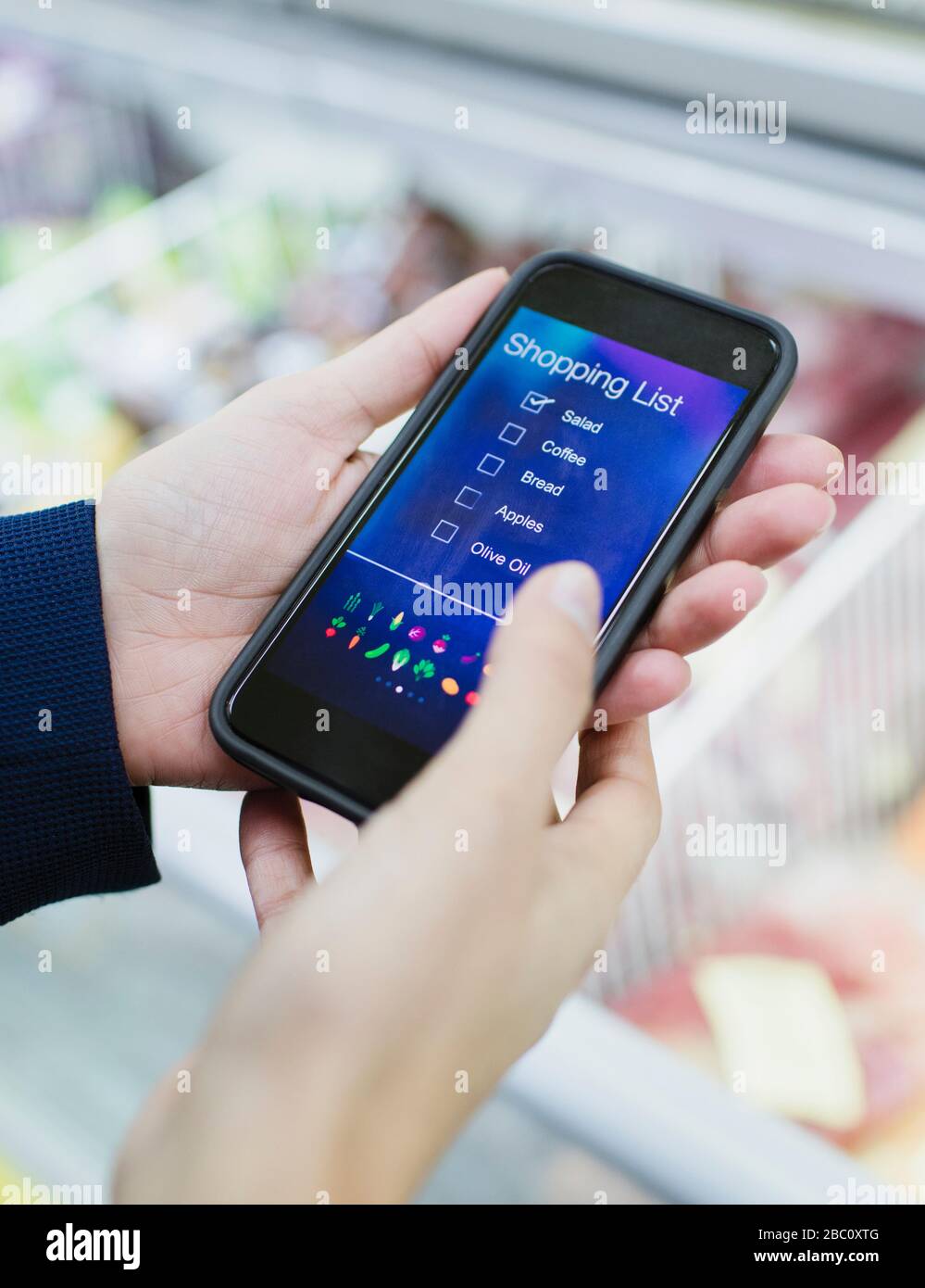 Young woman on store and using phone hi-res stock photography and ...