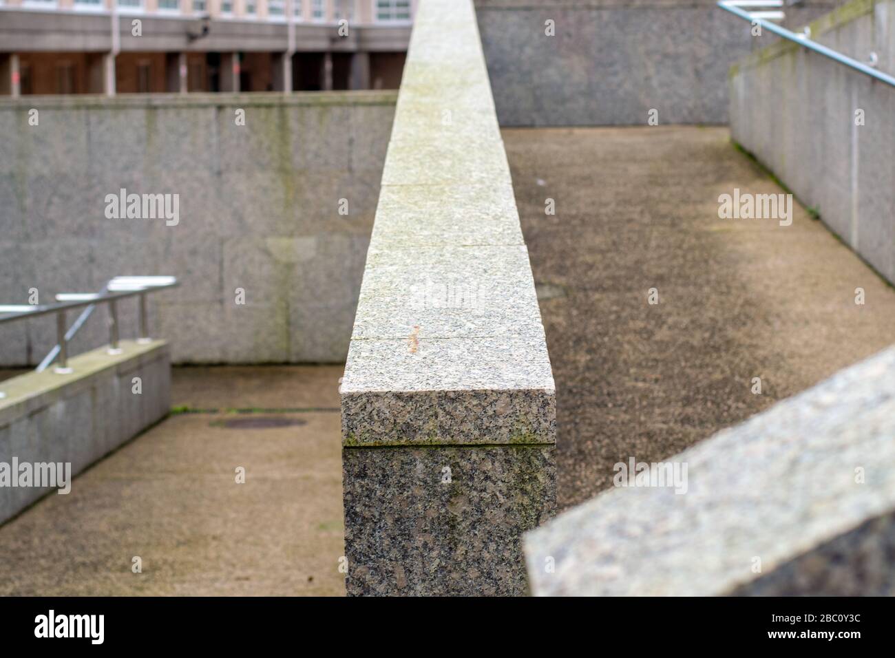 horizontal urban photography of a ramp for the disabled in the middle ...