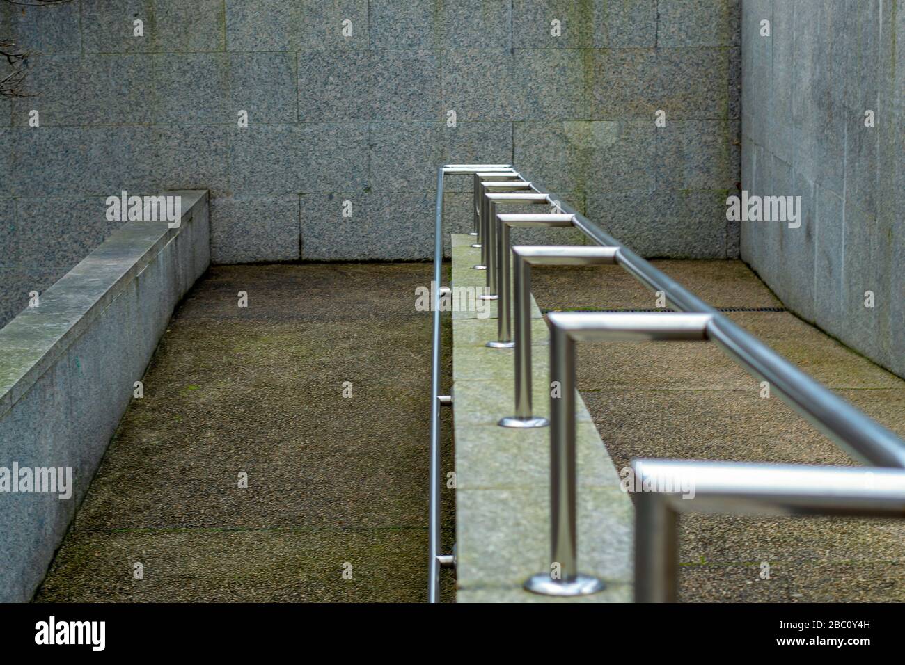 horizontal urban photography of a ramp for the disabled in the middle ...