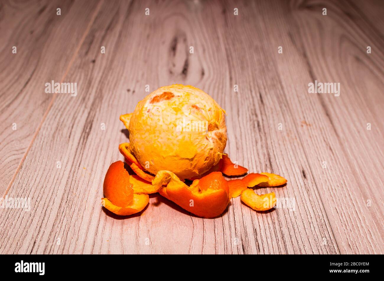 peeling an orange Stock Photo - Alamy