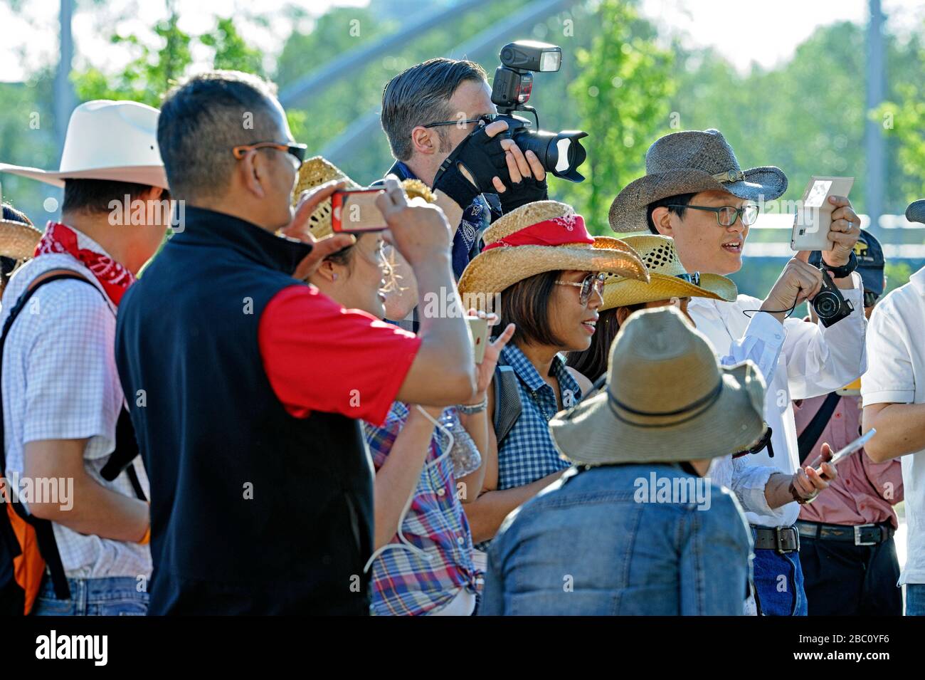 Tourists taking photographs at the Calgary Stampede Parade Stock Photo ...