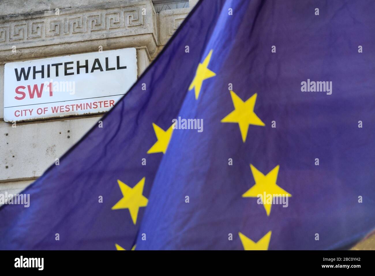 Whitehall, SW1 sign outside Downing Street with EU flag in foreground ...