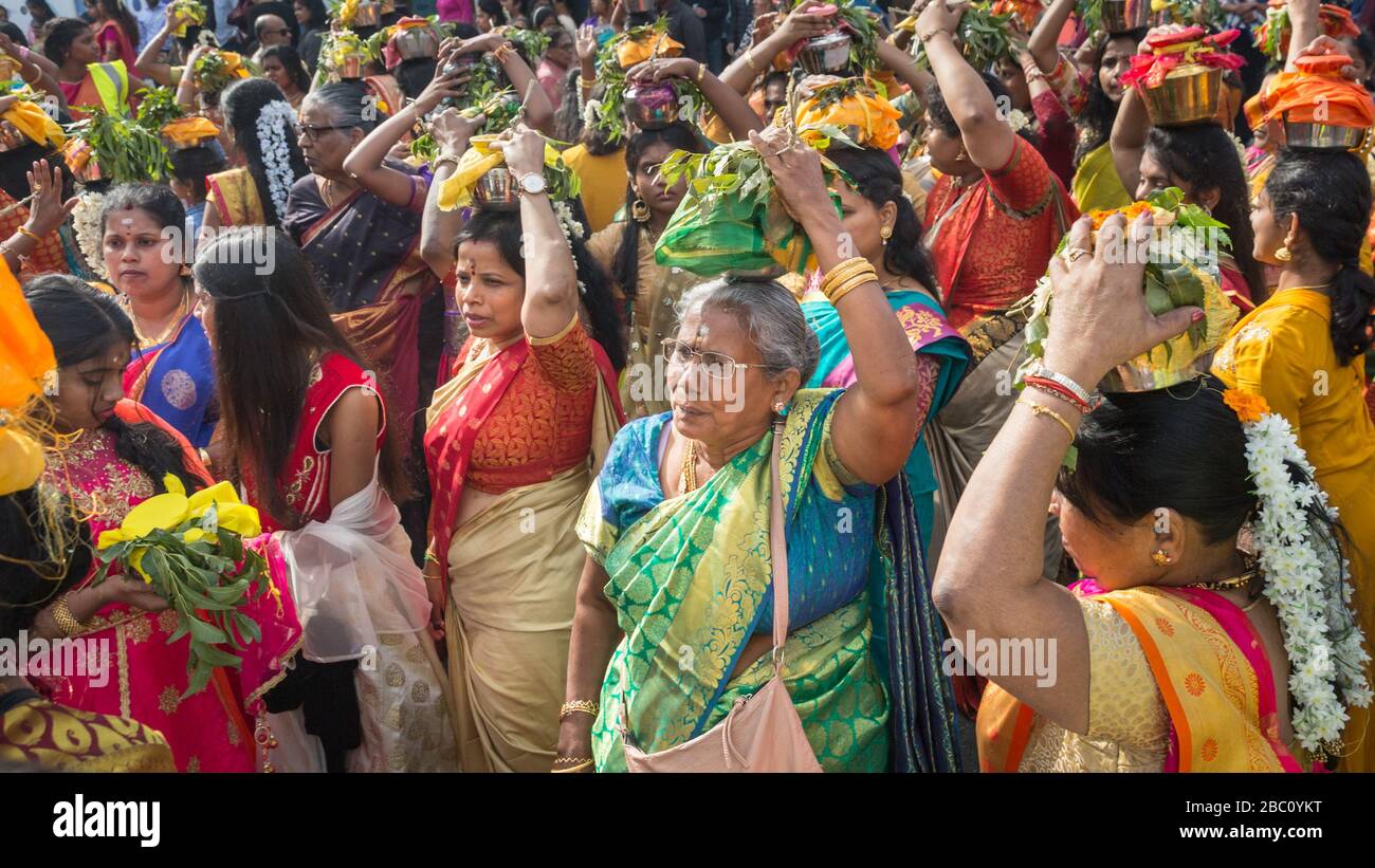 Hindu women in colourful saris, participate in a Chariot Festival ...