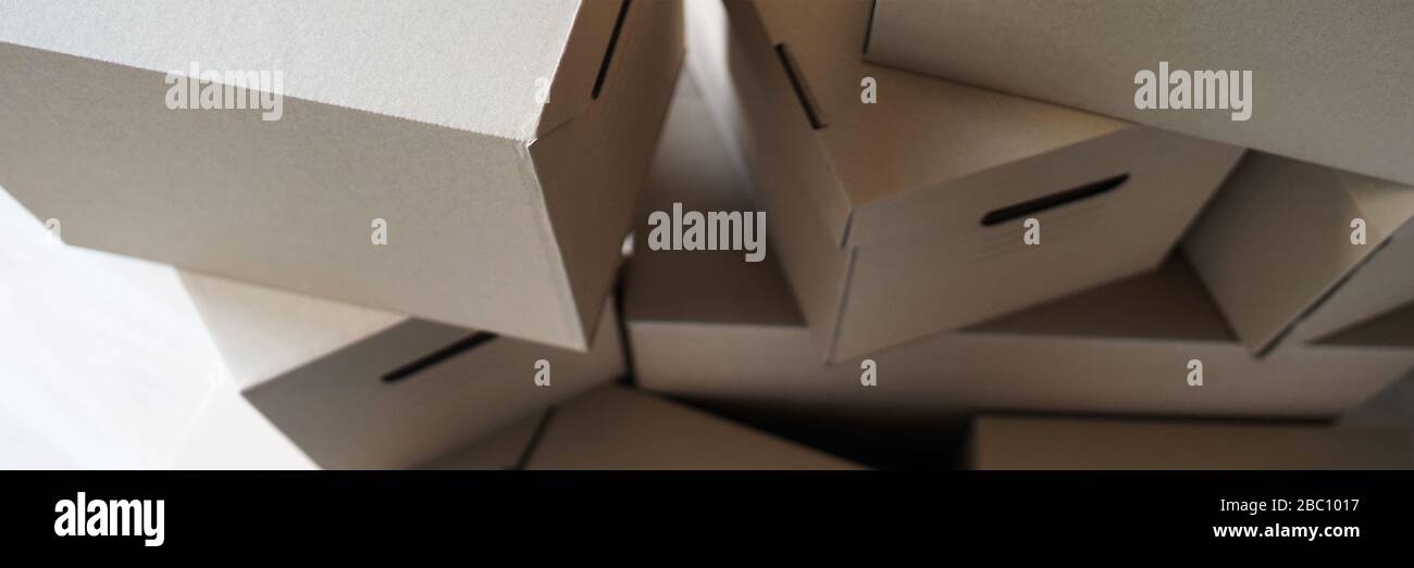 Pile of carton boxes standing in the middle of empty room in new house ...