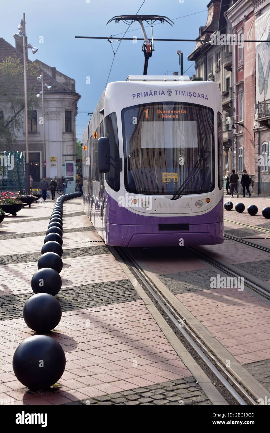 Romania, Timis, Timisoara, Modern tram passing Plata Libertatii, old ...