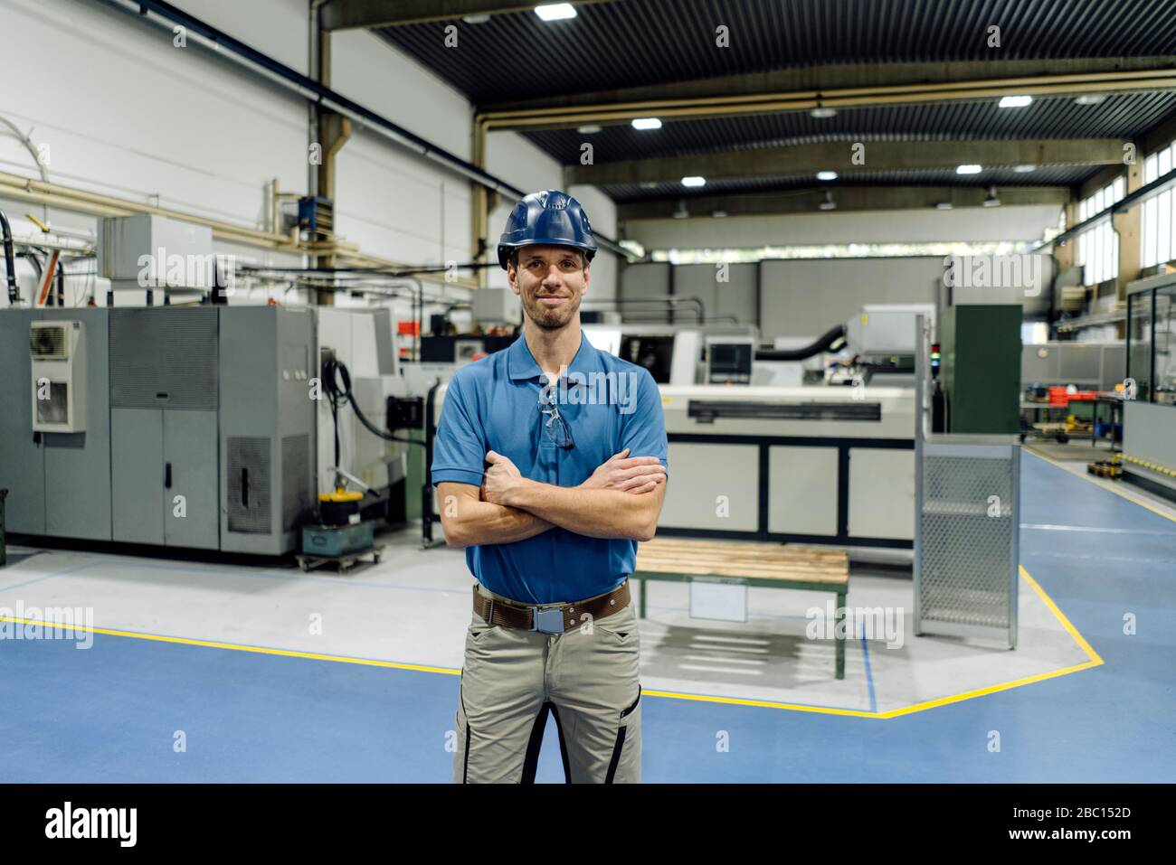 Portrait of a confident worker in a factory wearing hard hat Stock ...