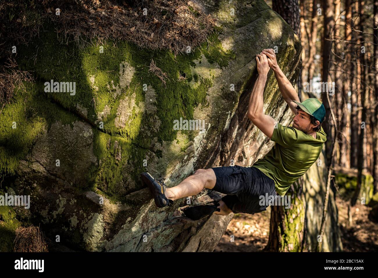 Climber bouldering on rock, Hochberg, Edenkoben, Rhineland-Palatinate ...