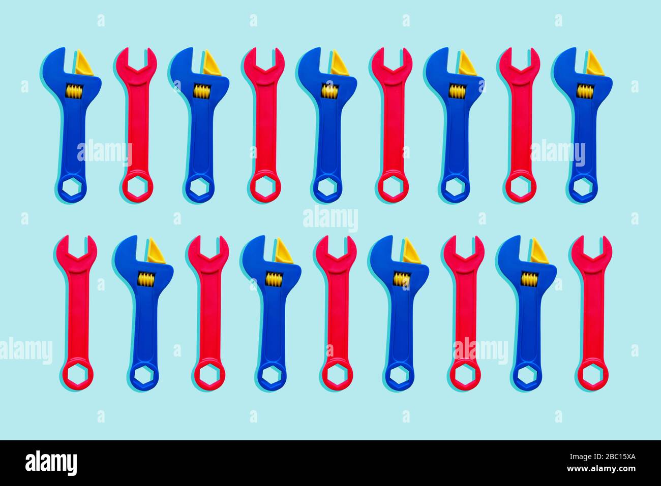 Illustration of two rows of red and blue toy wrenches Stock Photo - Alamy