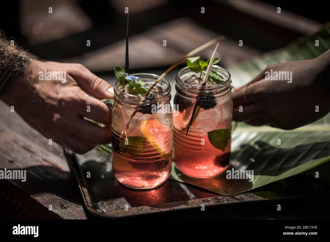 Hands holding iced tea hi-res stock photography and images - Alamy
