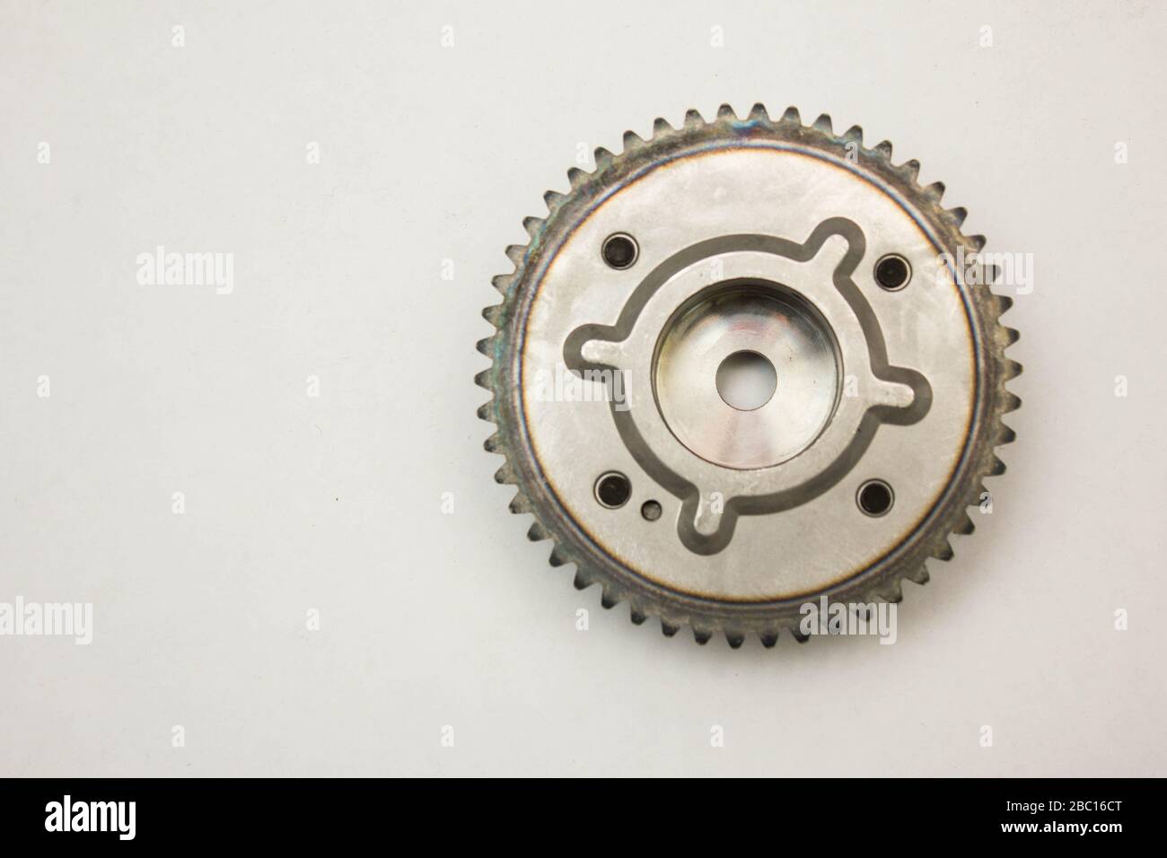 New details on a gray background. The camshaft gears Stock Photo - Alamy