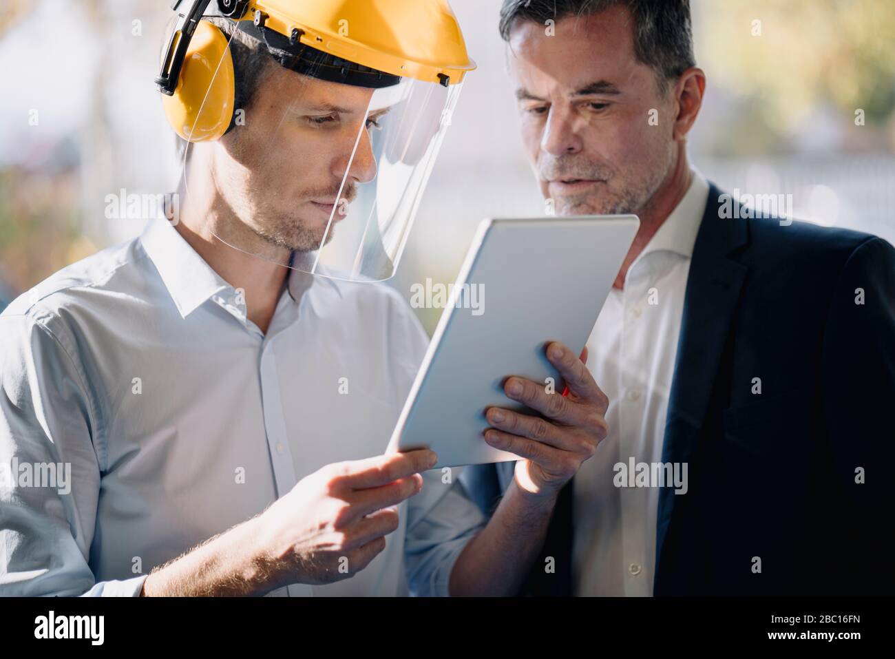 Manager holding helmet safety hi-res stock photography and images - Alamy