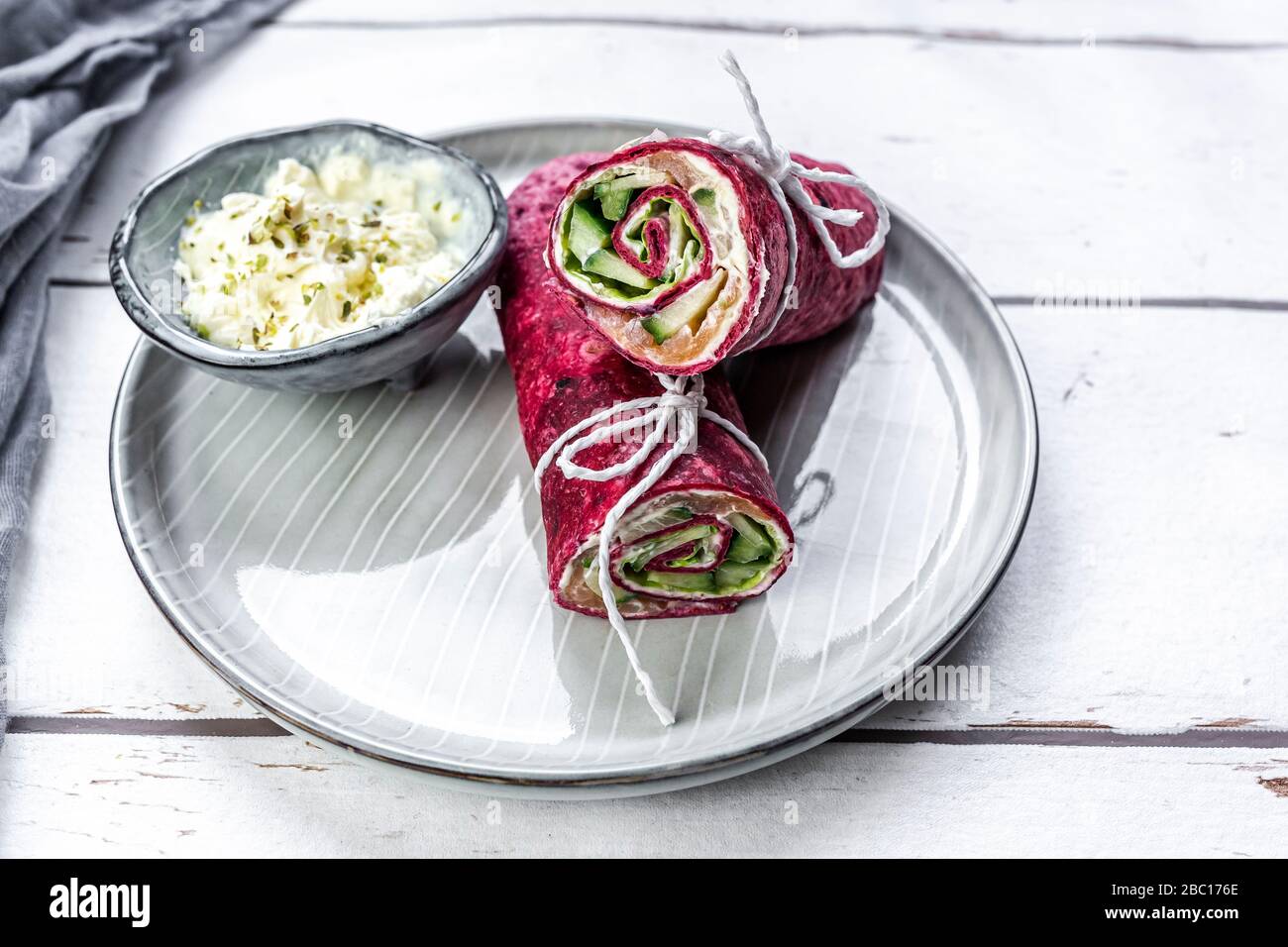 Beetroot wraps filled with ham, cheese, corn, iceberg lettuce ...