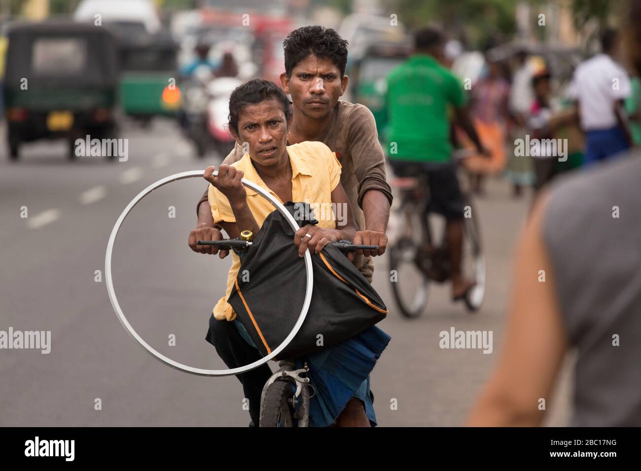 A local man and woman cycling in Negombo, Sri Lanka Stock Photo - Alamy