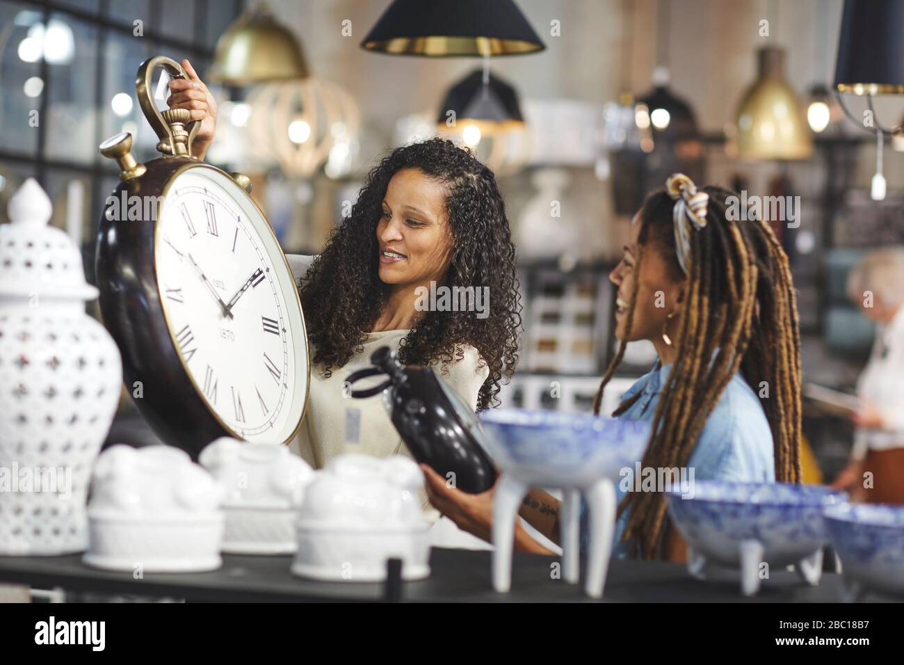 Wall clock in shop hi-res stock photography and images - Alamy