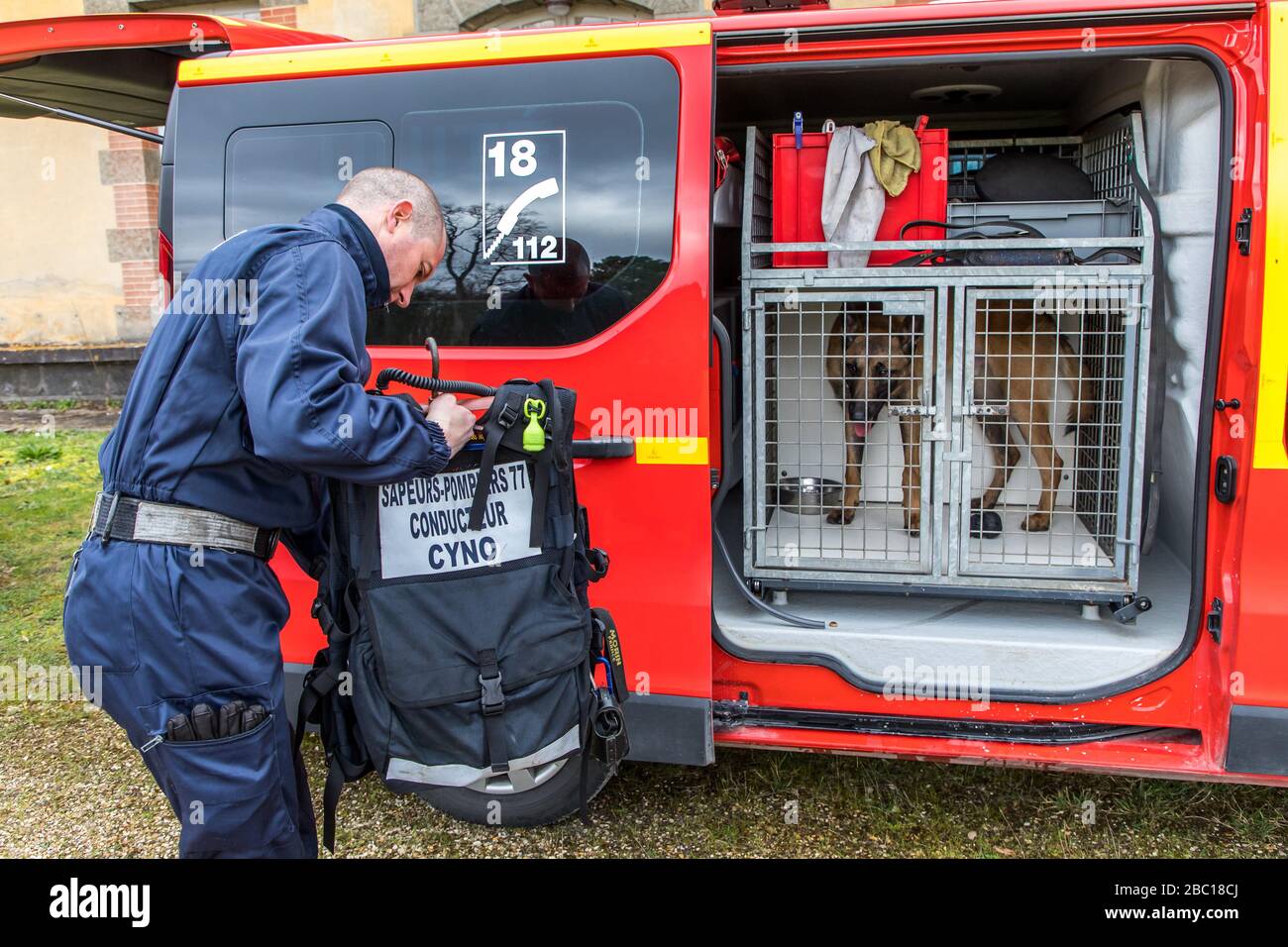 FIRE DEPARTMENT DOG HANDLER AND HIS DOG, MALINOIS OR BELGIAN SHEPHERD ...