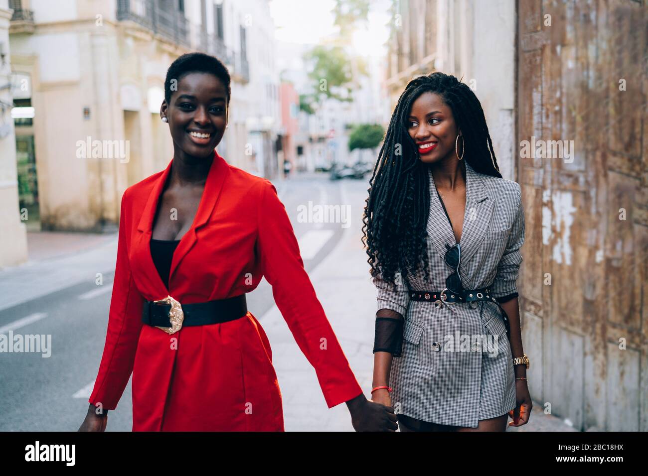Two women holding hands hi-res stock photography and images - Alamy