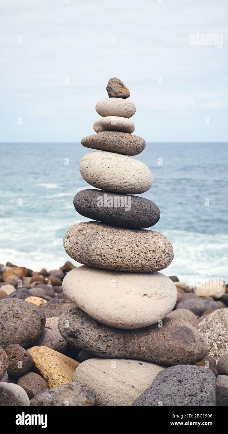 Balanced stone stack on a beach, selective focus Stock Photo - Alamy