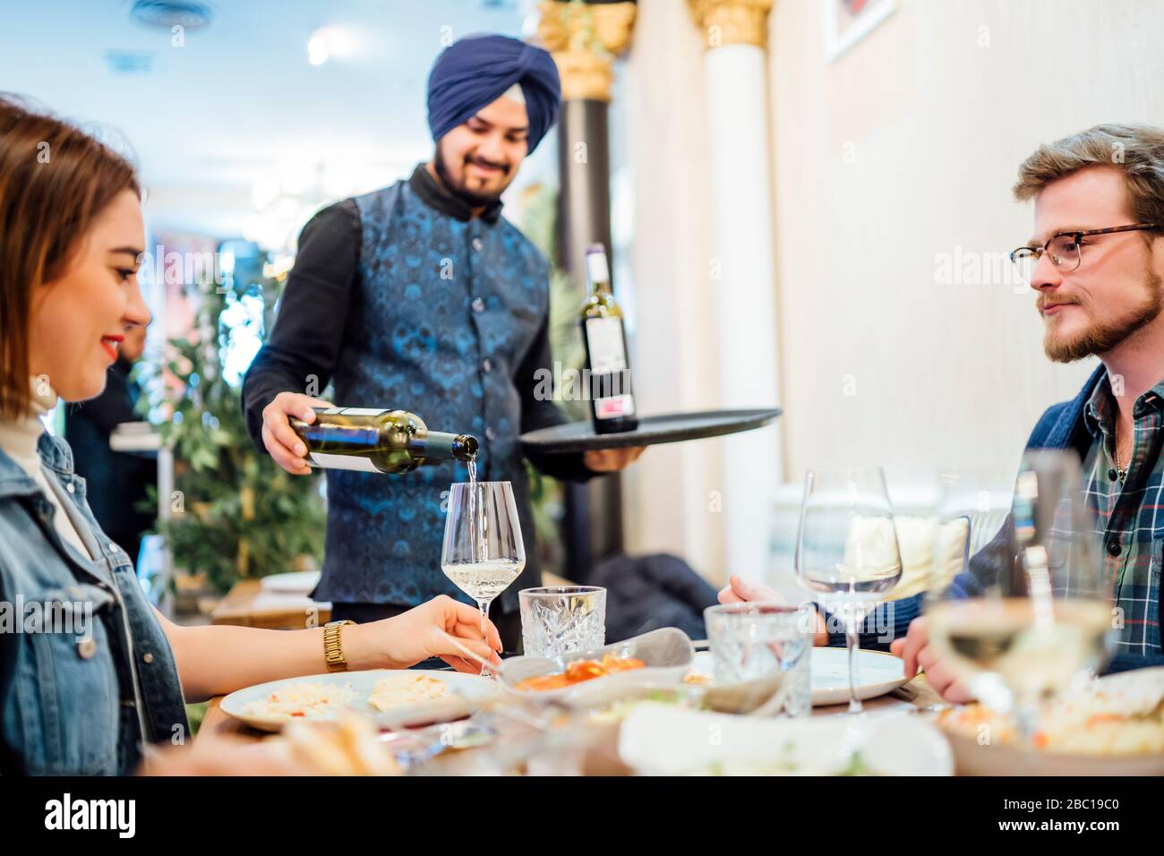 People eating in indian restaurant hi-res stock photography and images ...