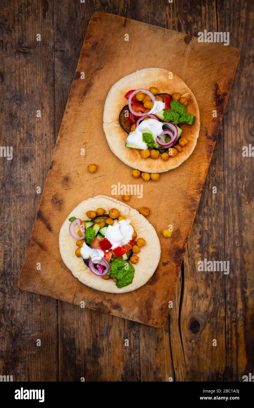 Israeli sabich with pita bread, eggplant, chick-peas, tomatoes ...