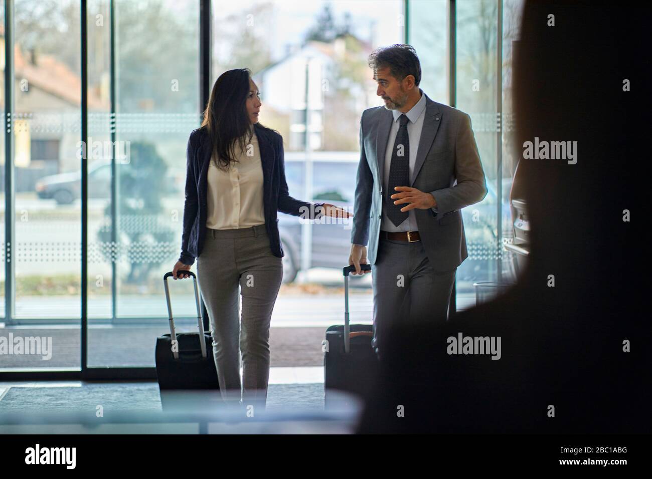 Couple entering hotel hi-res stock photography and images - Alamy