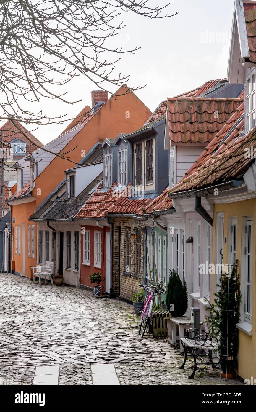 Pretty, colourful cottages in Aalborg, Denmark, on a wet, winters day ...