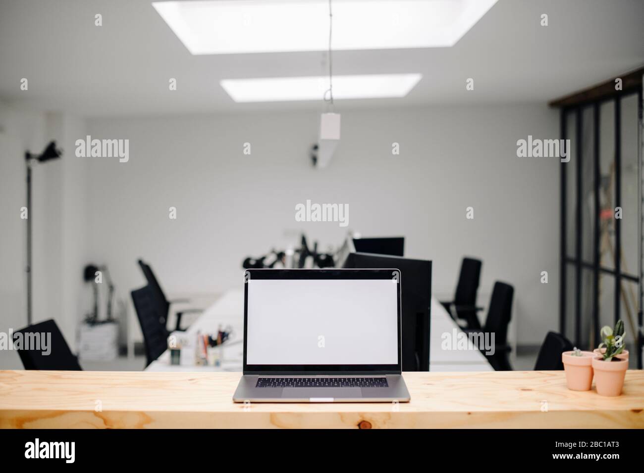 Laptop in conference room in loft office Stock Photo - Alamy