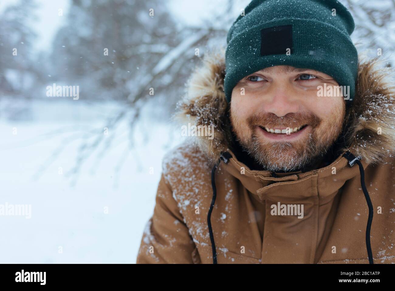 Portrait of smiling man in winter Stock Photo - Alamy