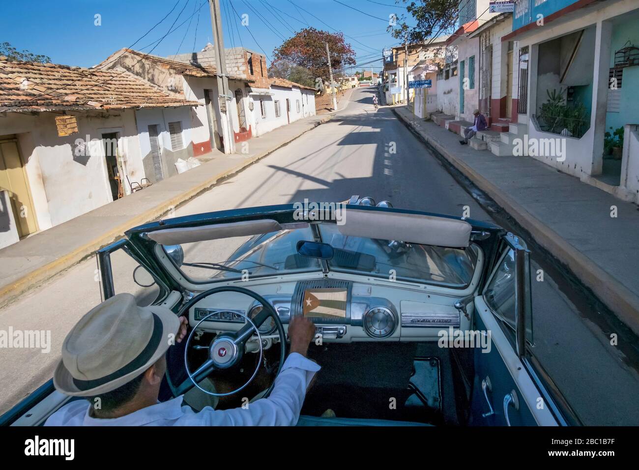Taxi driver driving vintage convertible car hi-res stock photography ...