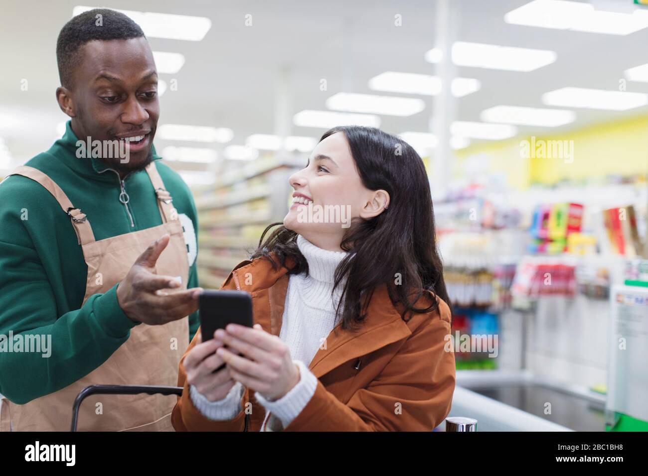 Helping customer young hi-res stock photography and images - Alamy