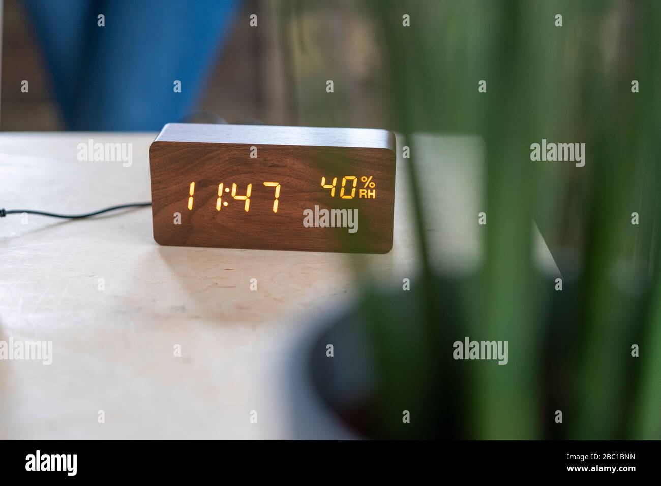 Wooden digital clock on desk Stock Photo - Alamy