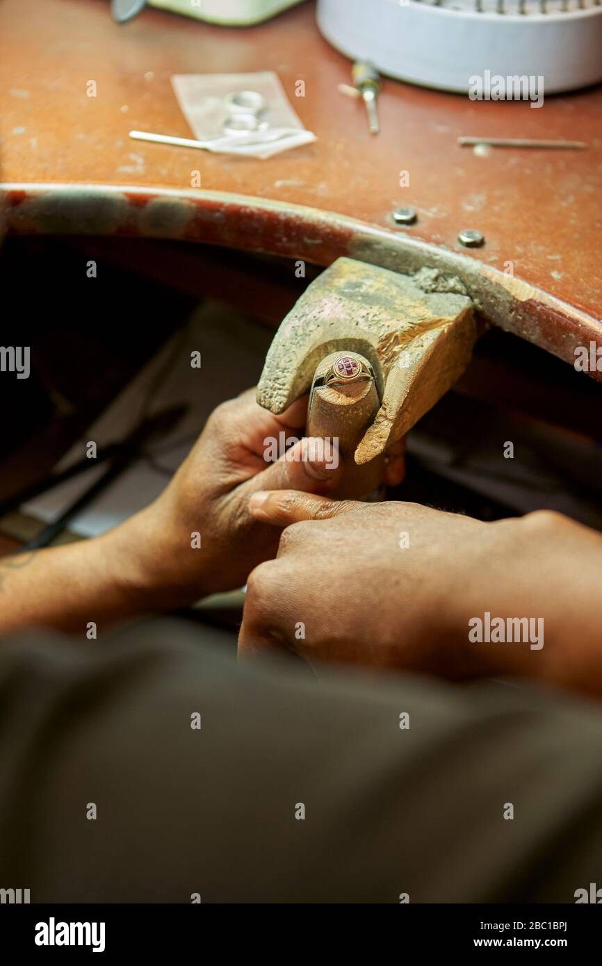 Man repairing a ring with a missing diamond Stock Photo - Alamy