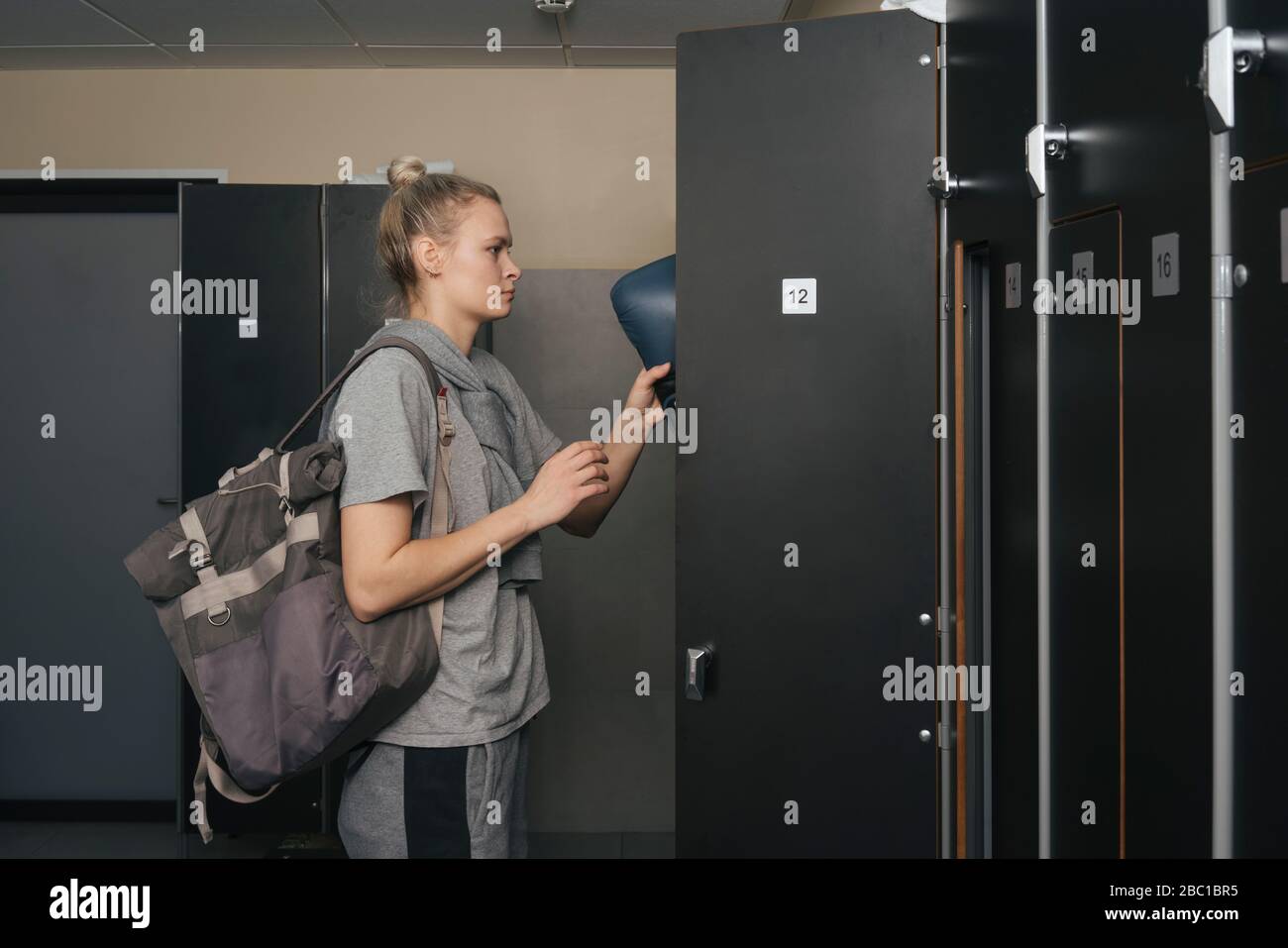Changing clothes woman locker room hi-res stock photography and images ...