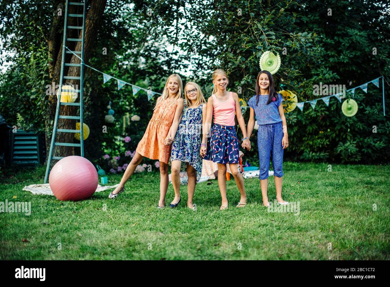 Portrait of happy girls on a birthday party outdoors Stock Photo - Alamy