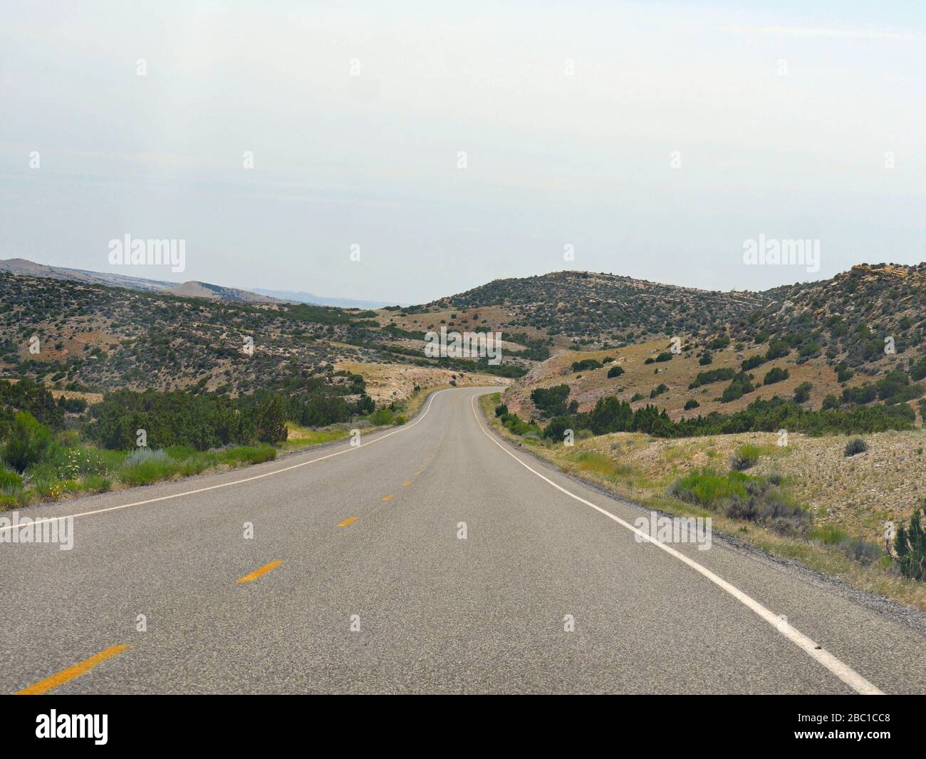 Paved curbing road on the outskirts of Cody heading to the Wyoming ...