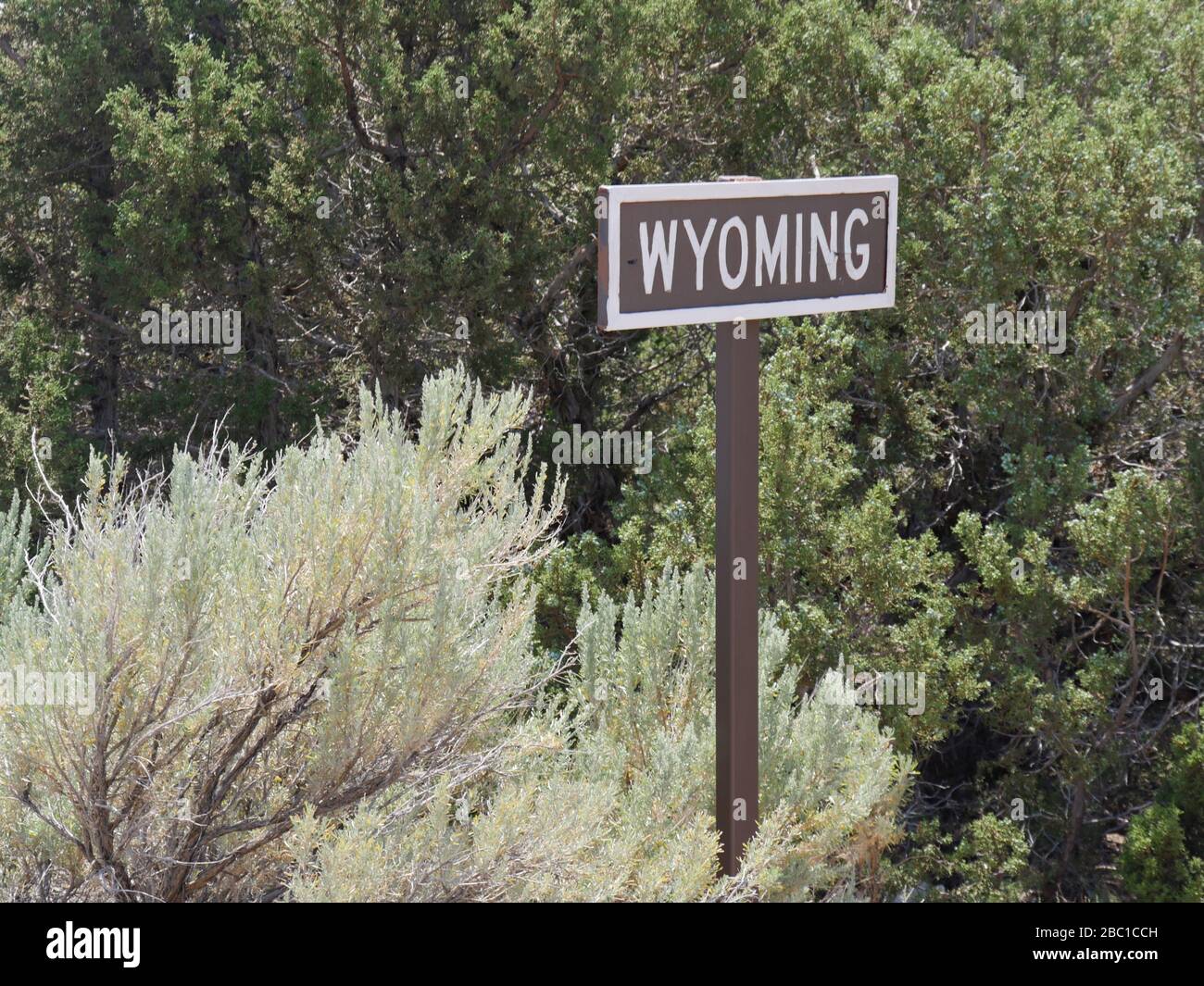 Roadside sign at the Wyoming state border from Montana, approaching ...