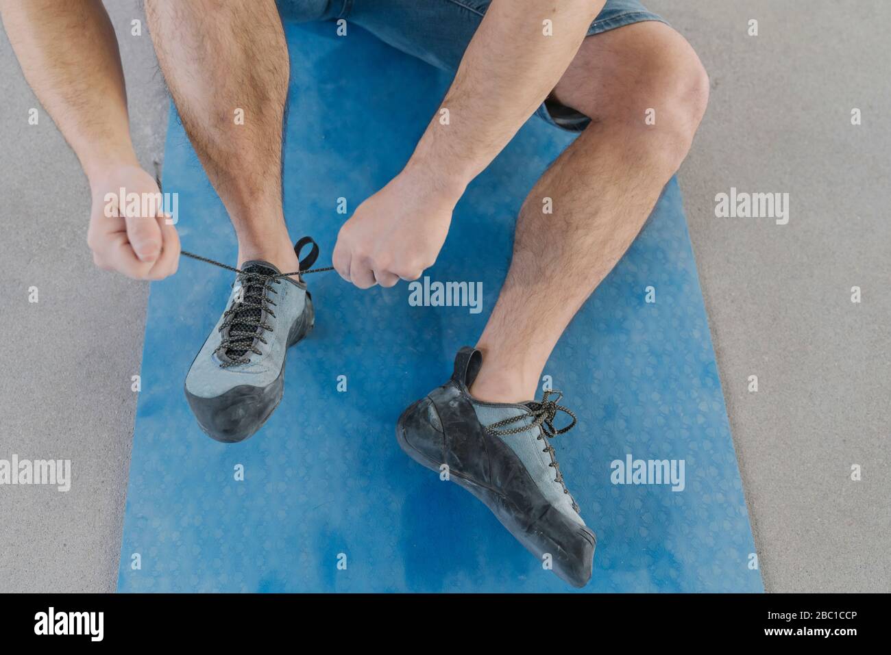 Man putting on shoes hi-res stock photography and images - Alamy