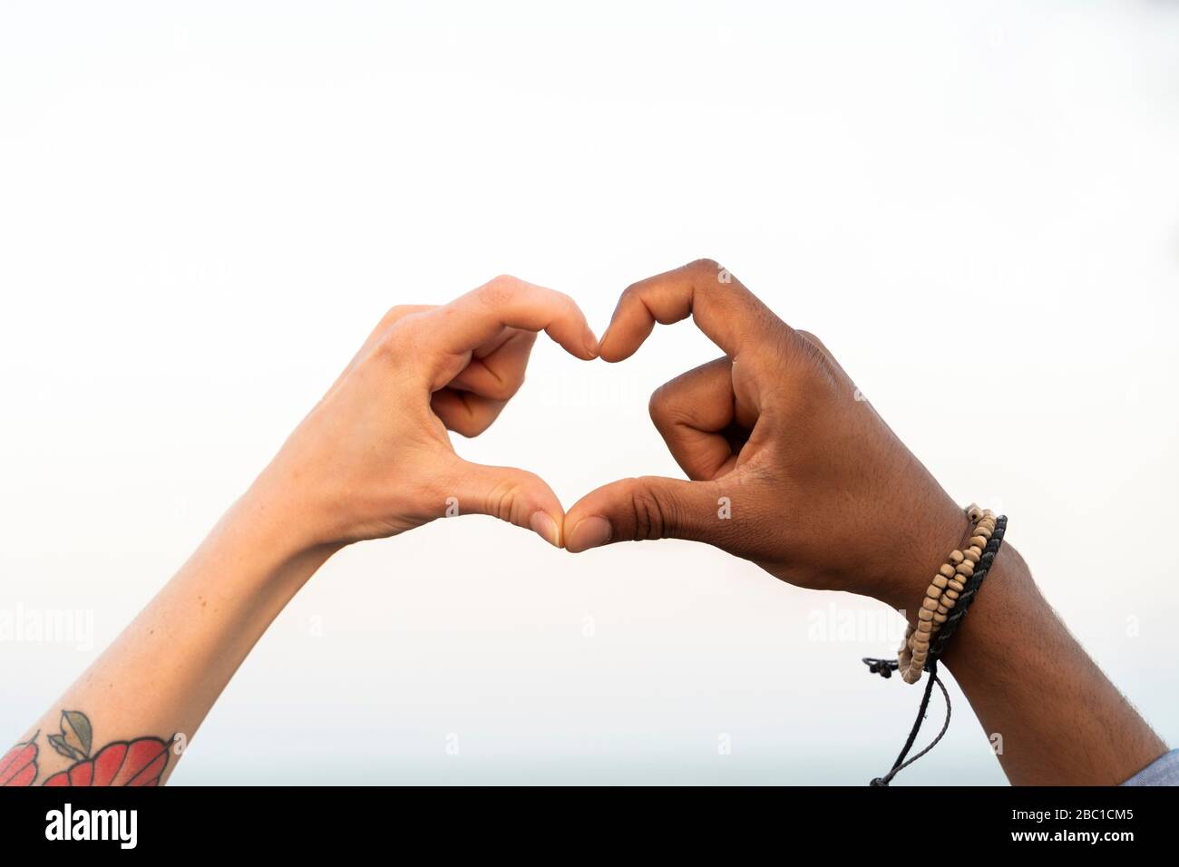 Holding Hands Heart Tattoo