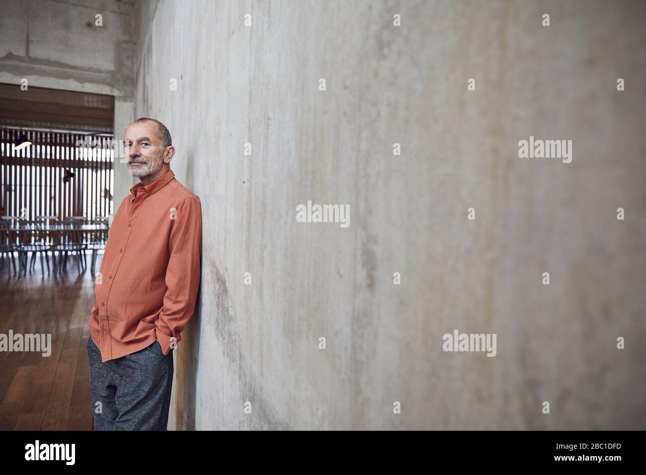 Senior businessman standing minimalistic office hi-res stock ...