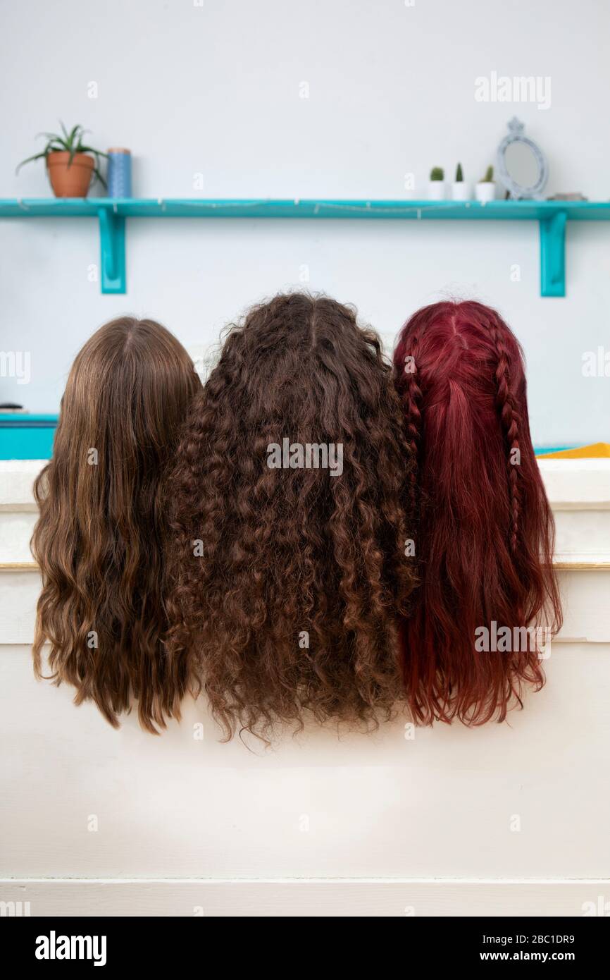 Back view of three sisters with long hair Stock Photo - Alamy