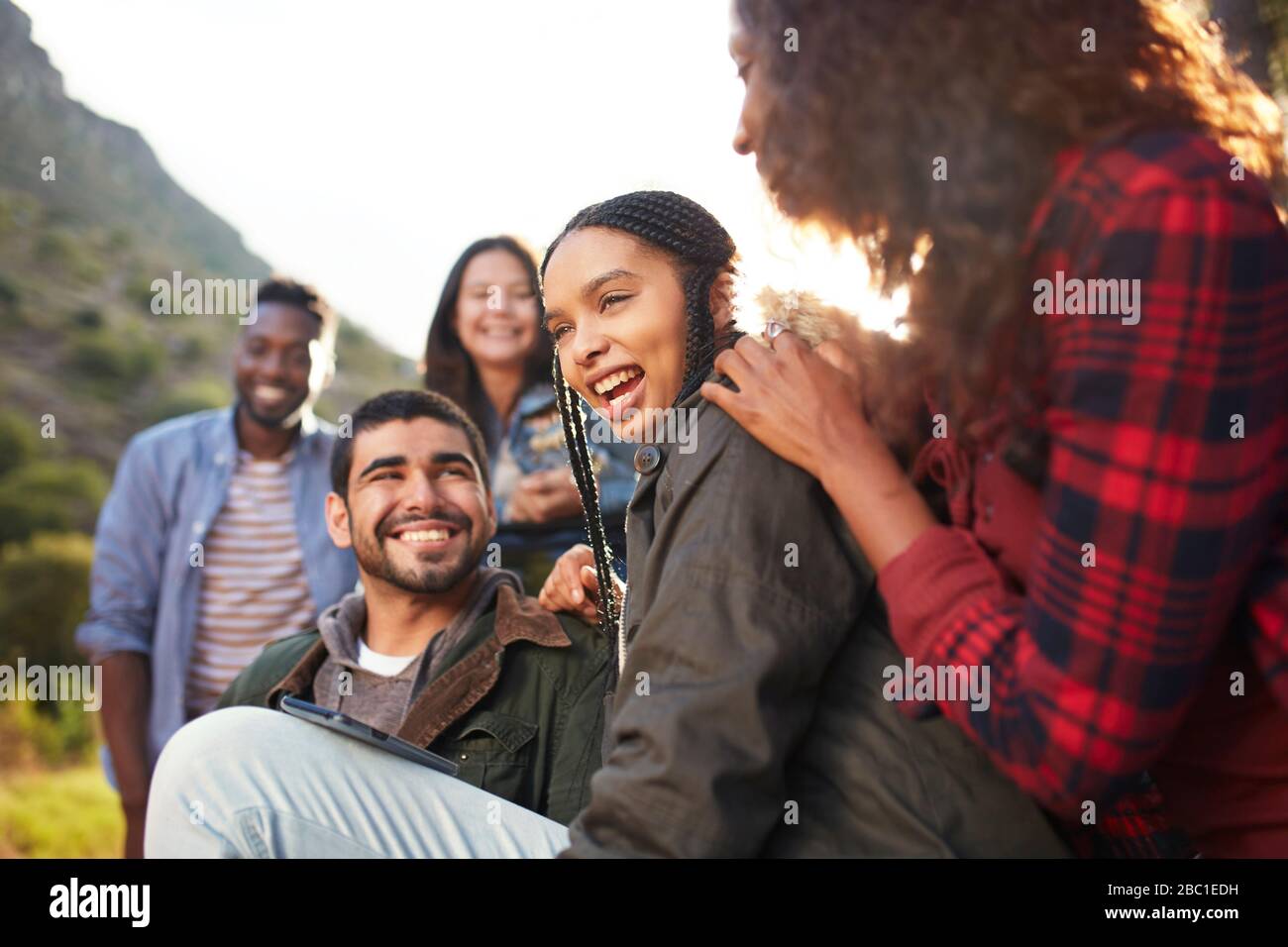Young friends laughing, hanging out Stock Photo - Alamy