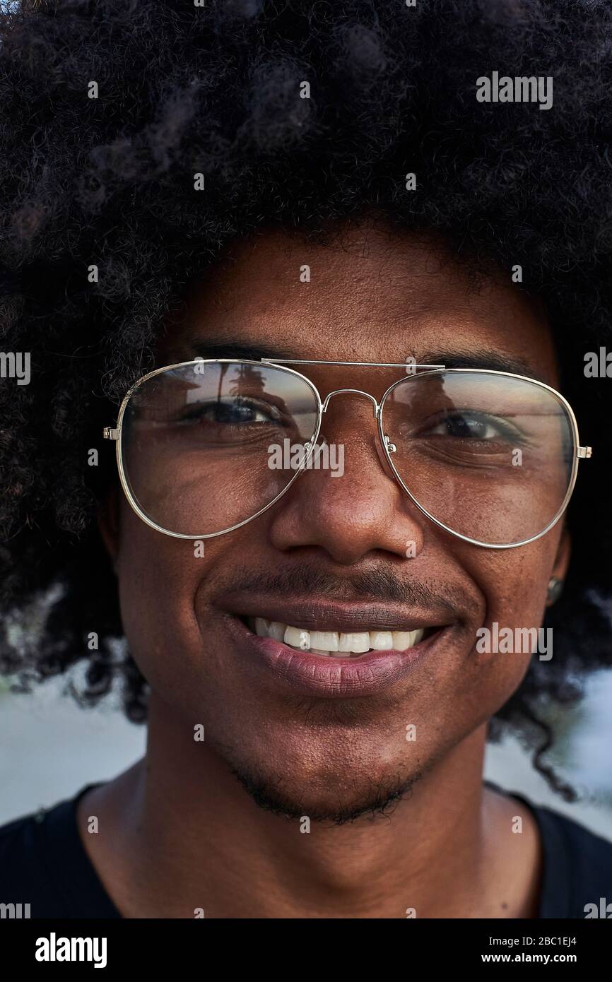 Young black man wearing glasses hi-res stock photography and images - Alamy