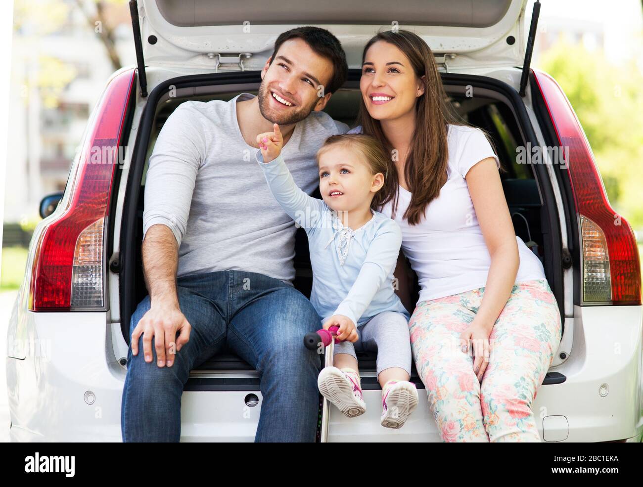 Happy family sitting in the car Stock Photo - Alamy