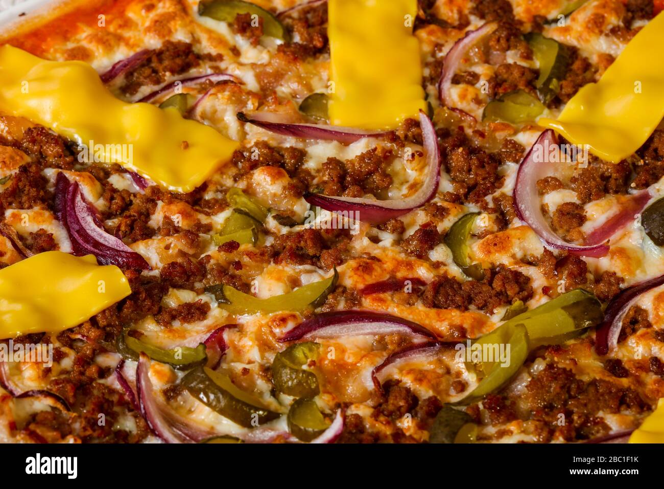Pizza with minced meat and cheese Stock Photo - Alamy
