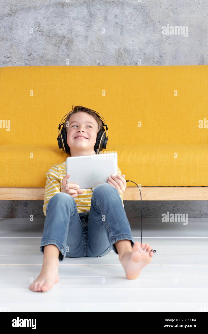 Boy playing tablet wearing hi-res stock photography and images - Alamy