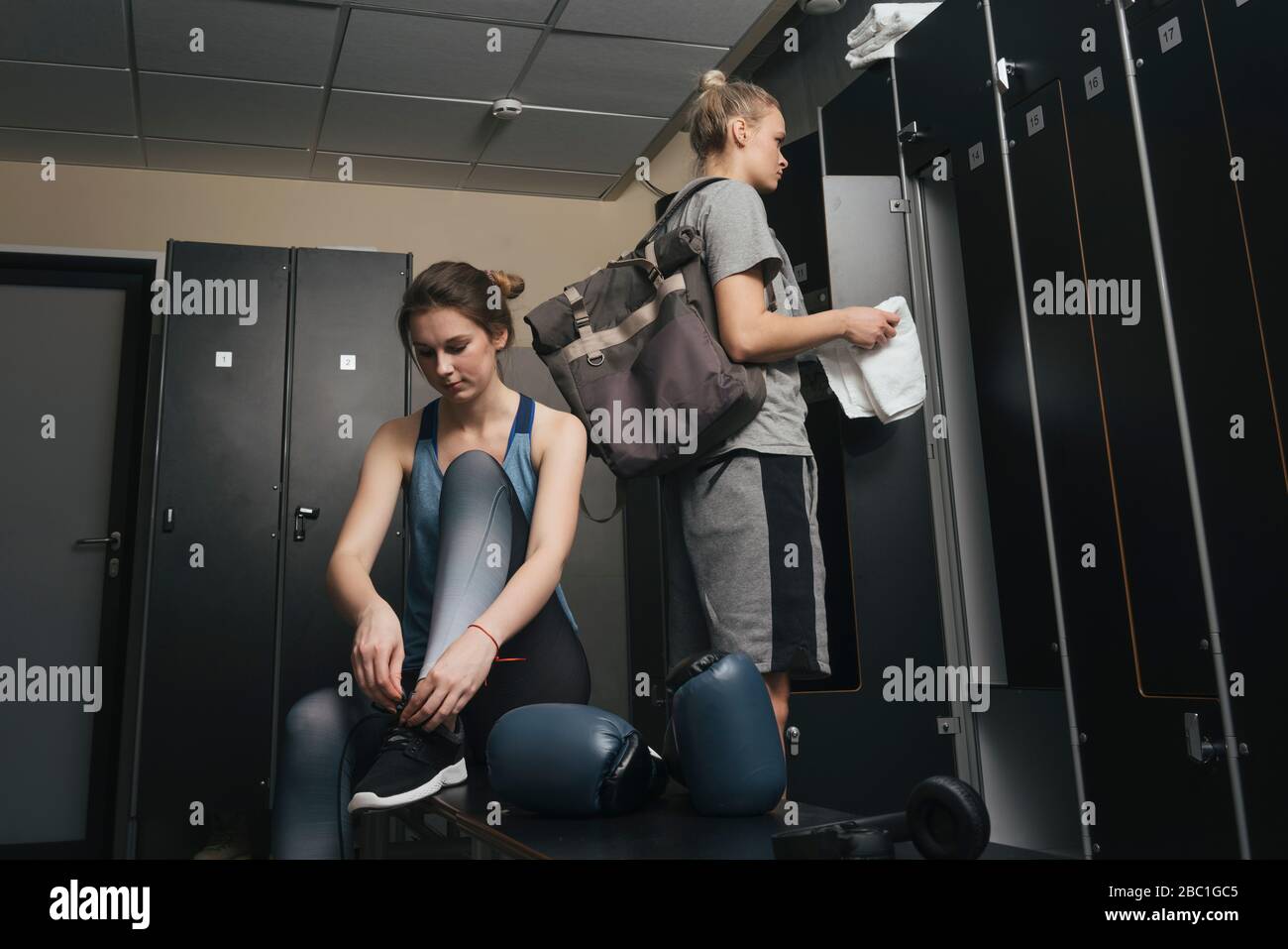 Changing clothes woman locker room hi-res stock photography and images ...
