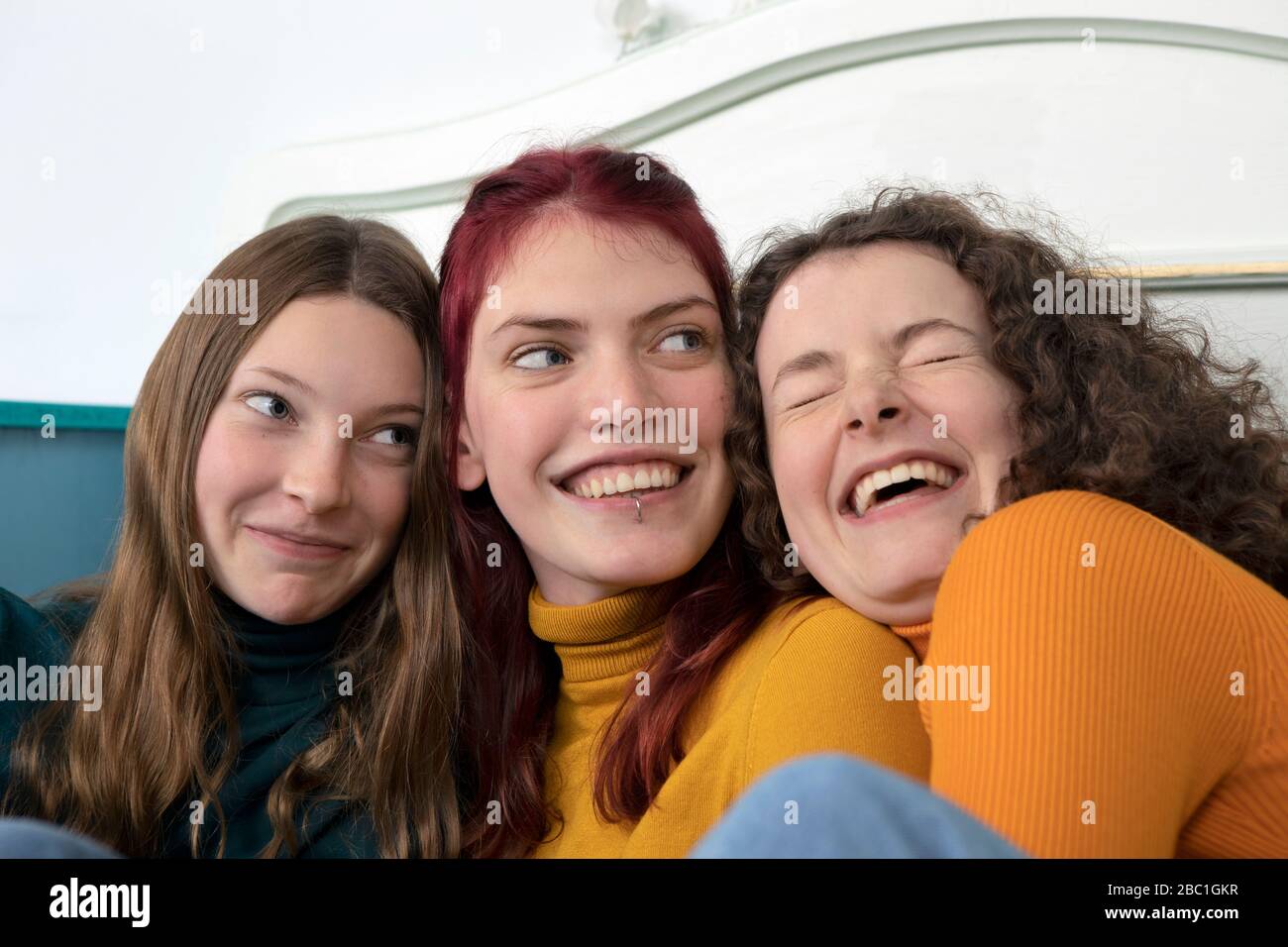 Three happy sisters hi-res stock photography and images - Alamy