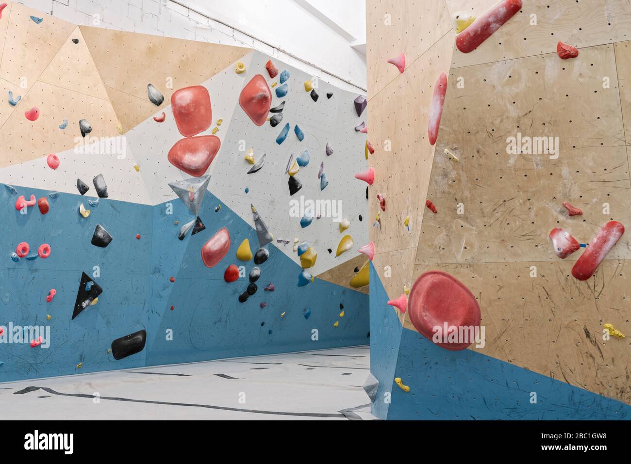 Interior of a bouldering hall Stock Photo - Alamy