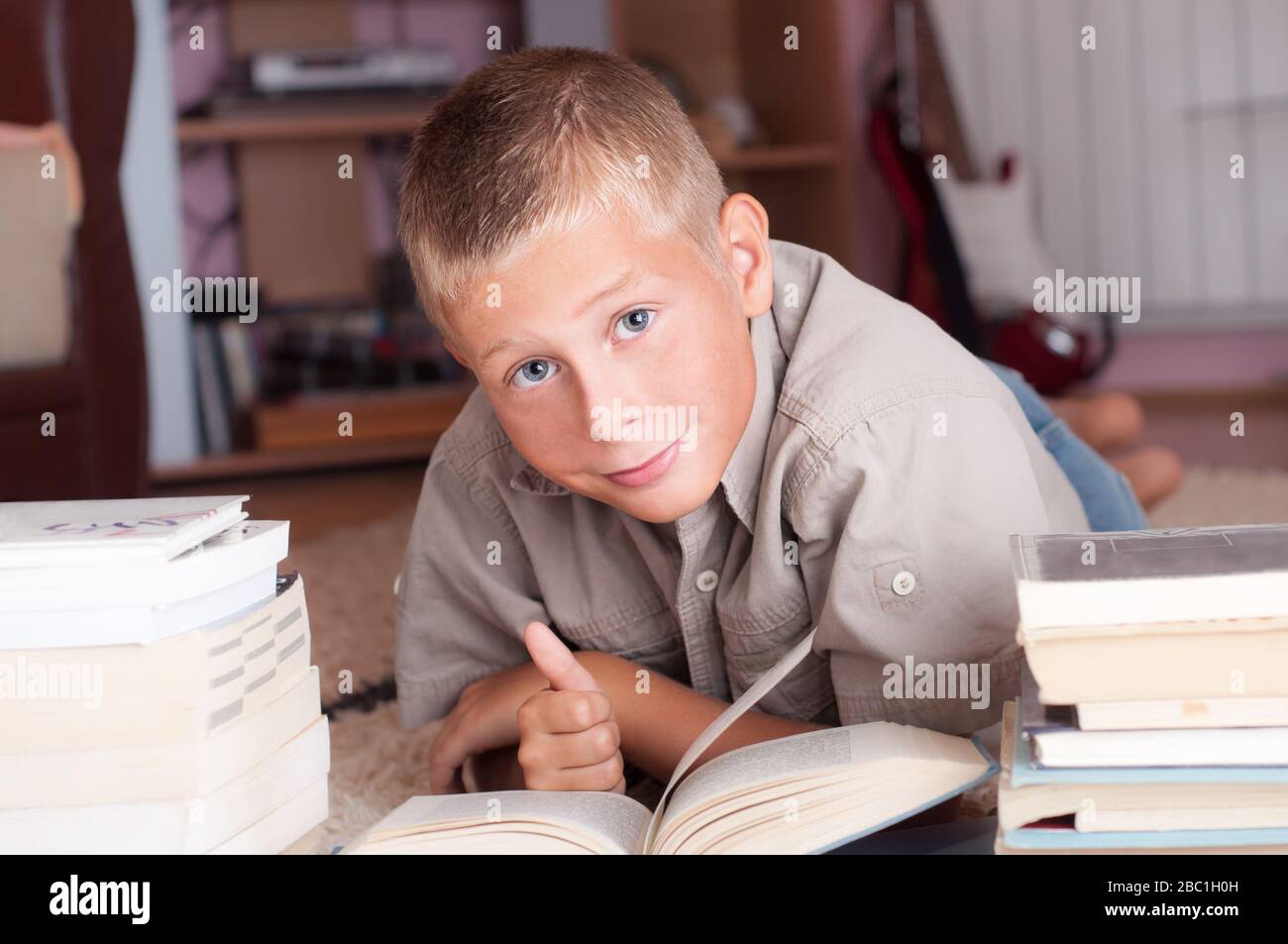 Young boy doing his homework at home - education Stock Photo - Alamy