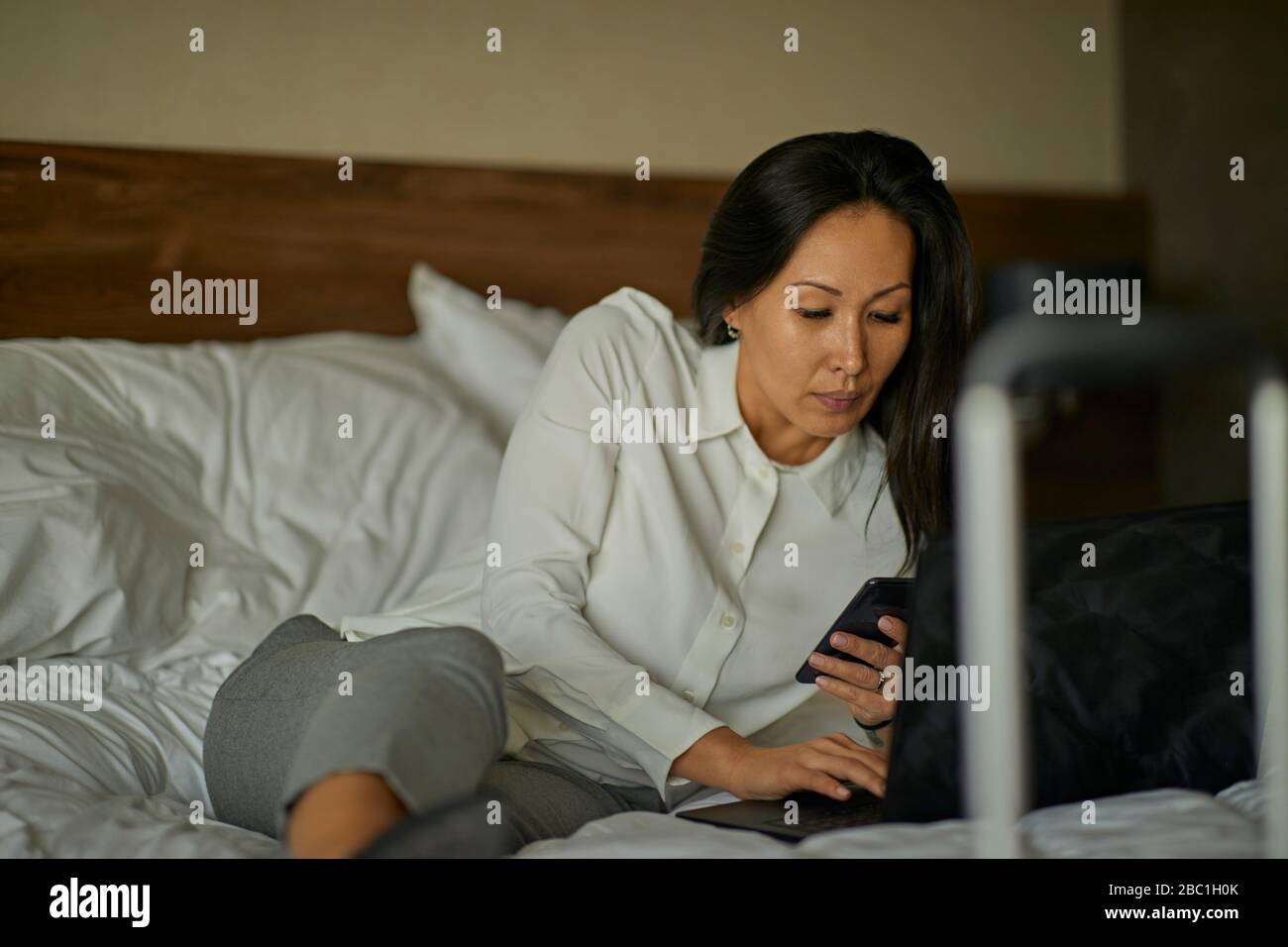 Hotel mobile phone checking in hi-res stock photography and images - Alamy